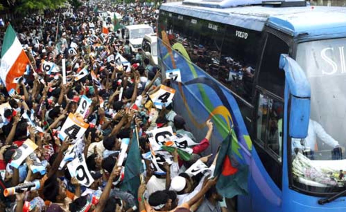 Bangladeshi cricket fans gather around the Indian team bus at ...