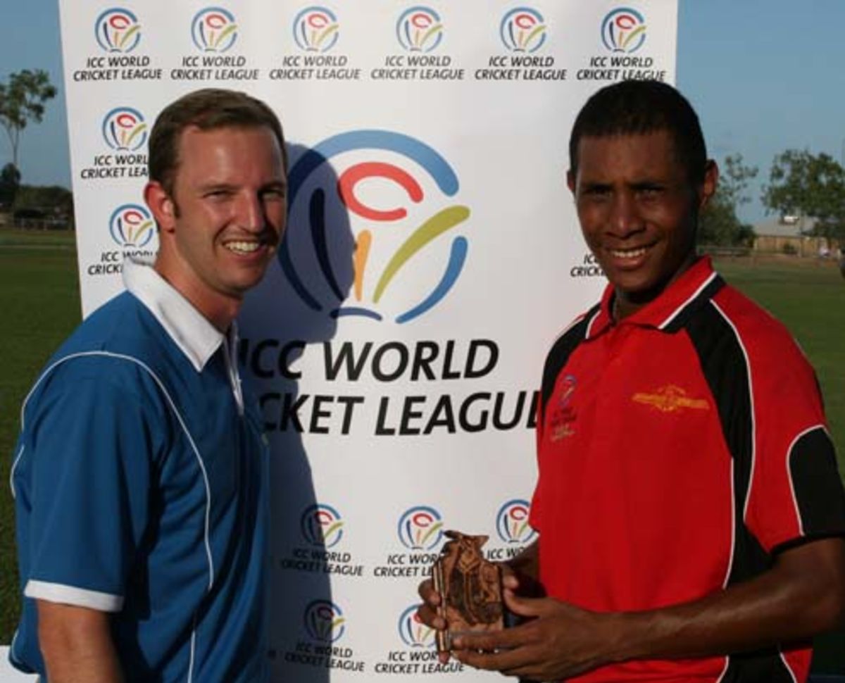 PNG players congratulate Chris Amini | ESPNcricinfo.com