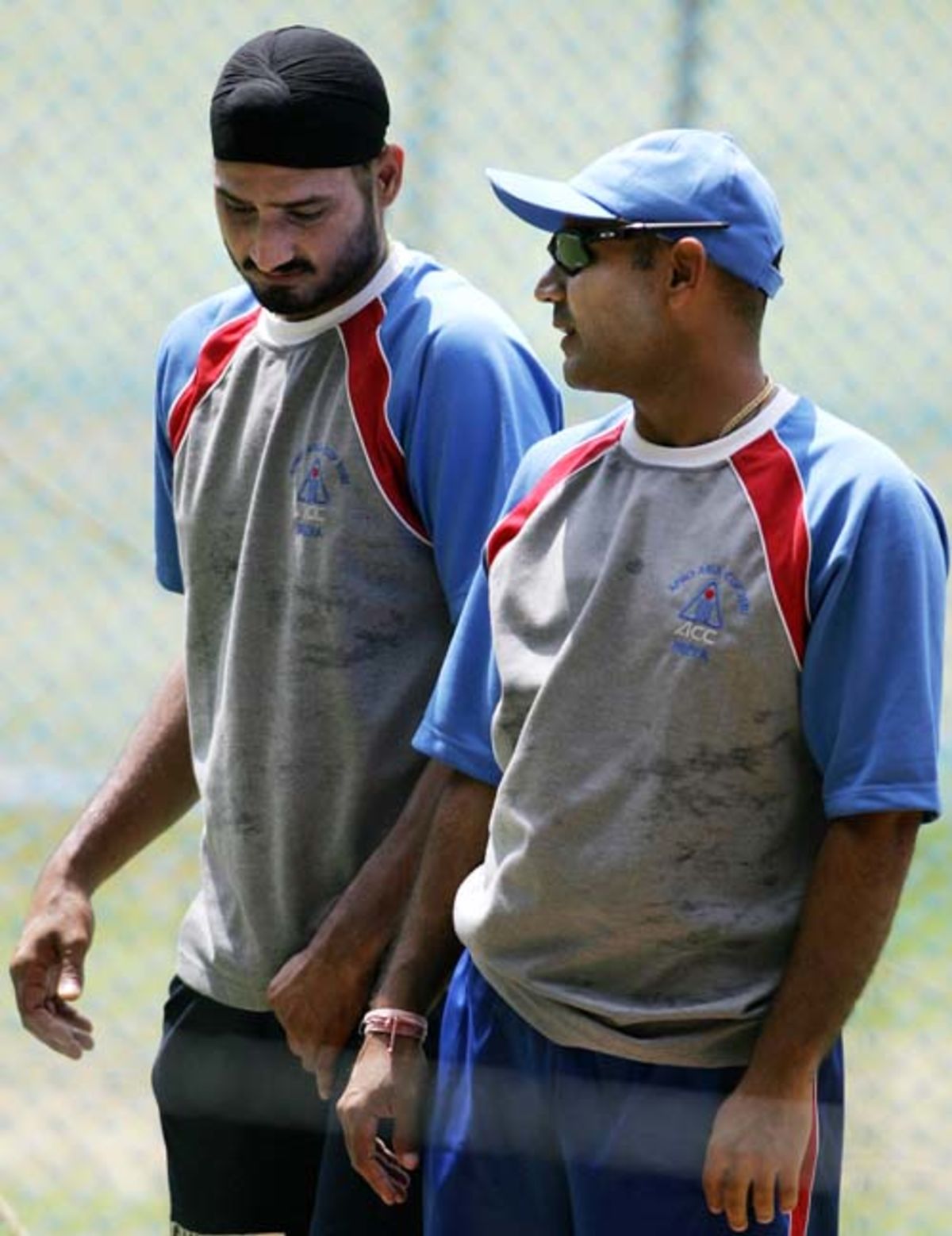 Asia XI cricketers Mohammad Yousuf and Harbhajan Singh chat during a ...
