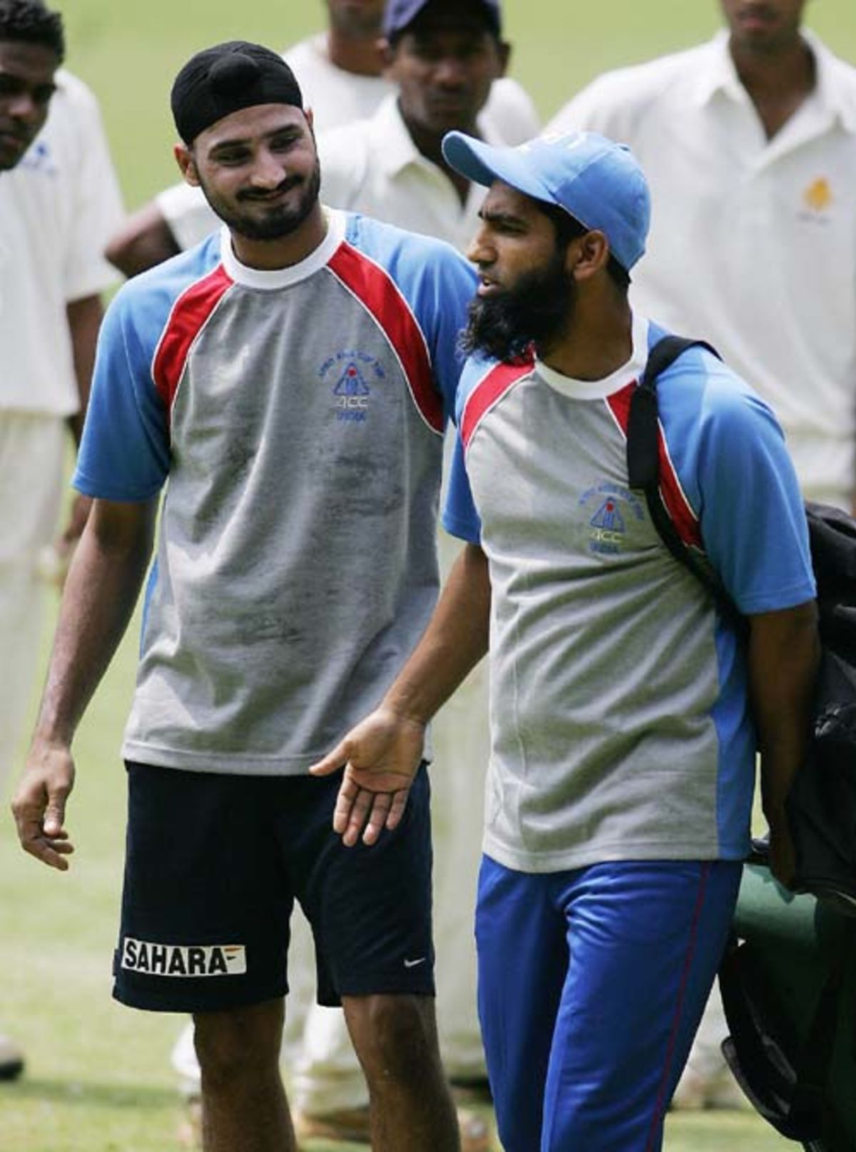 Asia XI cricketers Mohammad Yousuf and Harbhajan Singh chat during a ...