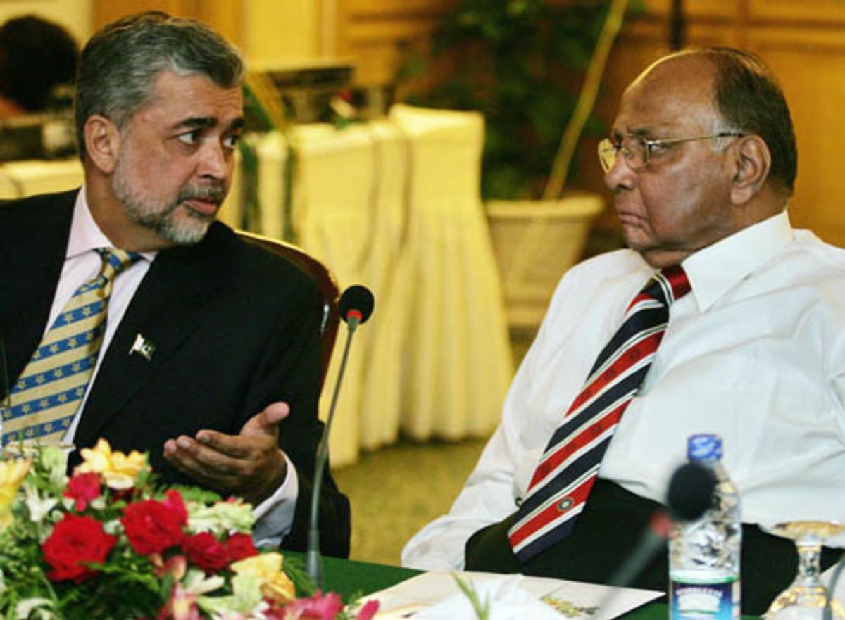 Nasim Ashraf talks to Sharad Pawar during a meeting at Bhurban ...