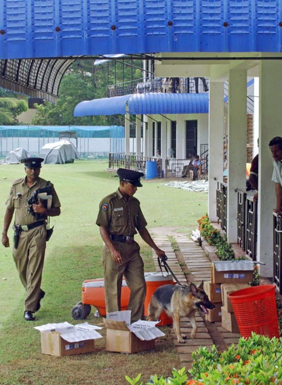 Sri Lankan police patrol the Colts Cricket Ground in Colombo ...