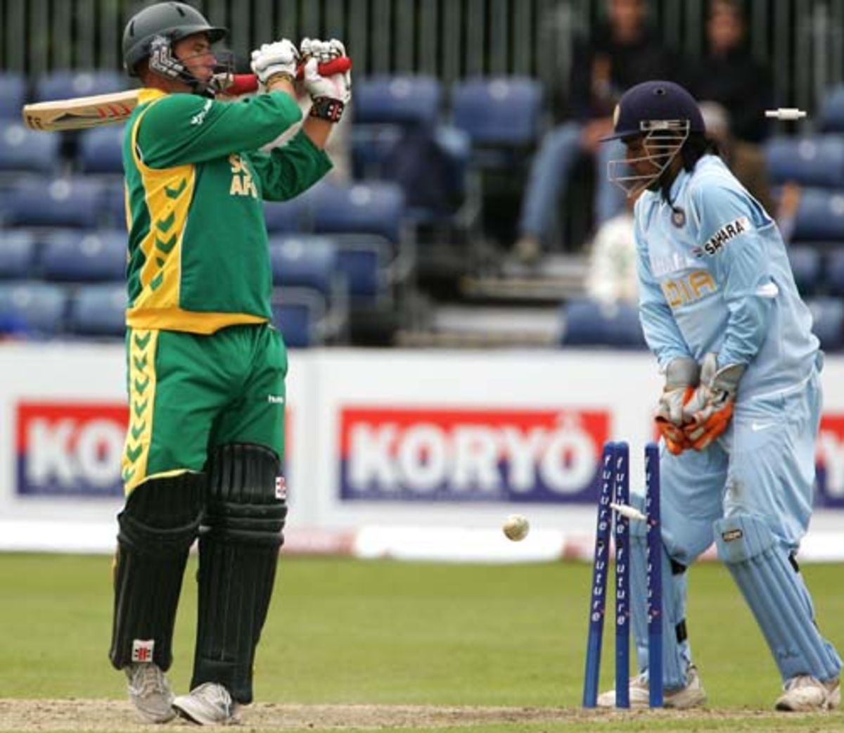 Andrew Hall has his stumps rearranged after attempting a wild pull shot ...