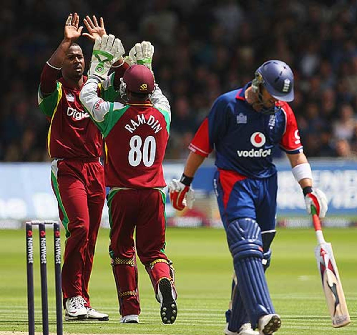 Dwayne Smith and Denesh Ramdin celebrate the dismissal of Matt Prior ...