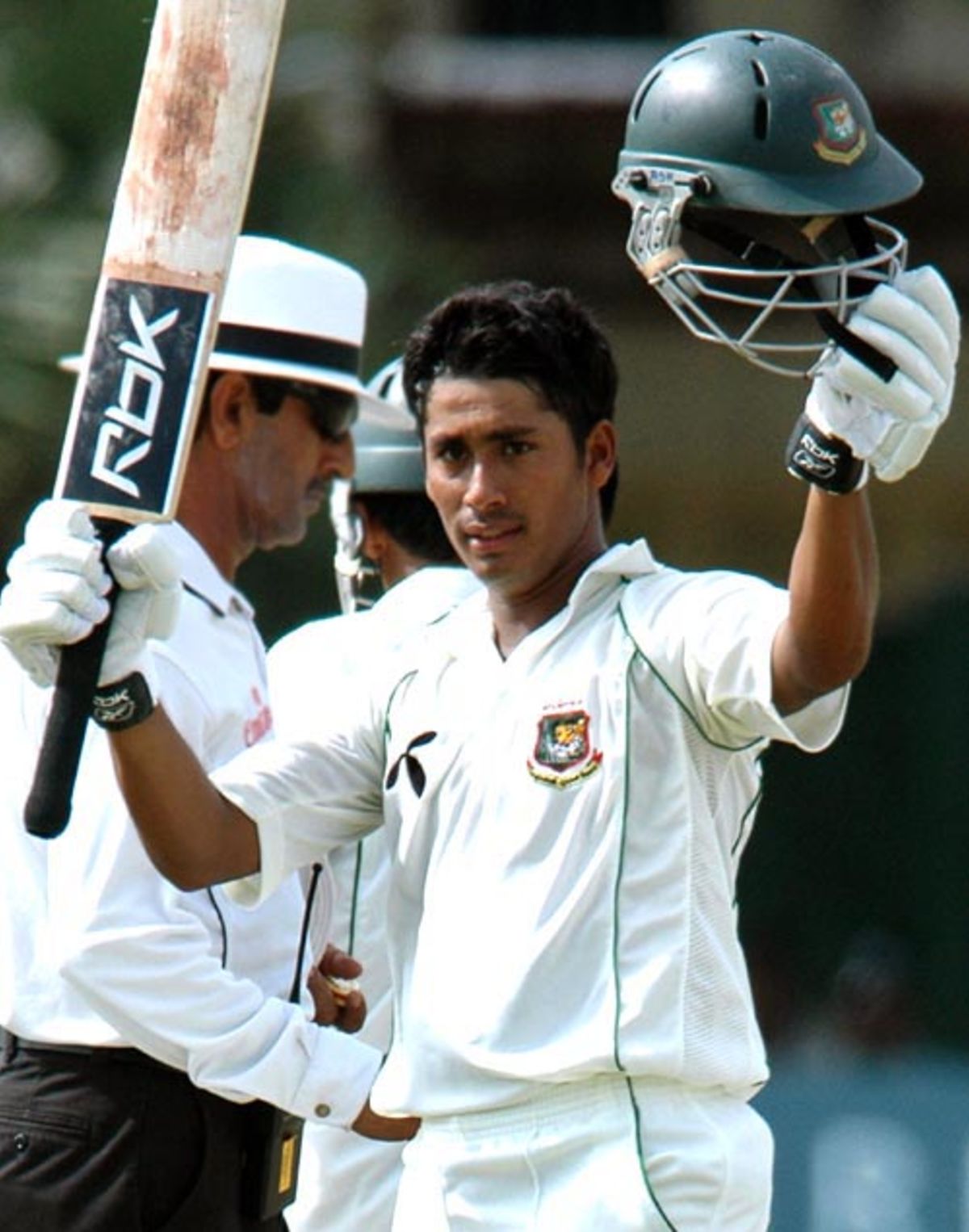 Mohammad Ashraful raises his bat after his fourth Test hundred ...