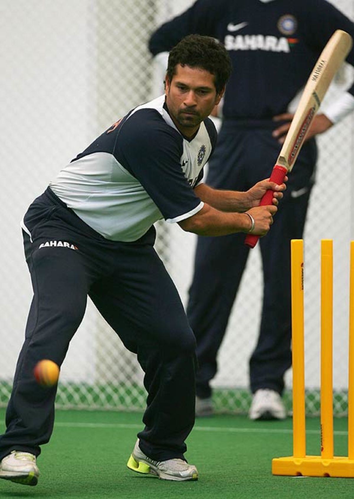 Sachin Tendulkar stretches his bowling arm in the nets | ESPNcricinfo.com