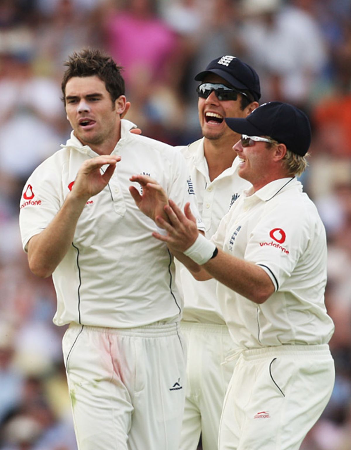 Alastair Cook and Ian Bell congratulate James Anderson on a wicket ...