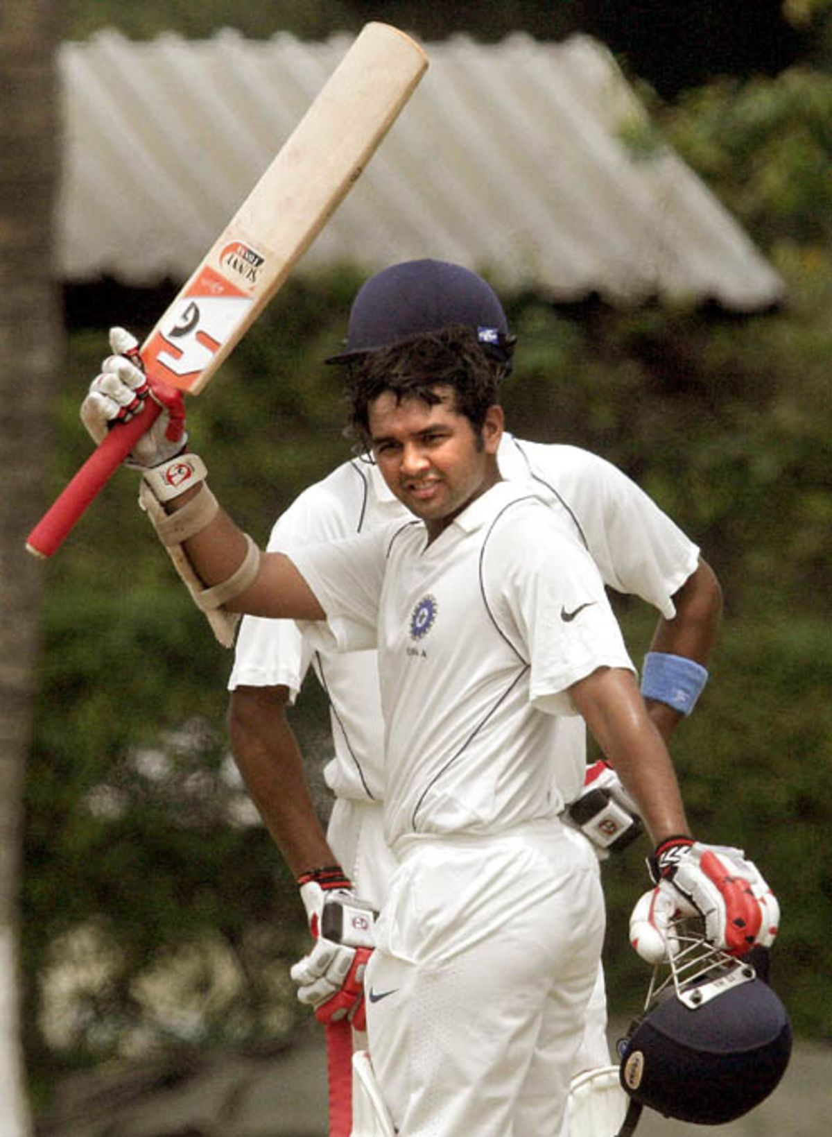 Parthiv Patel acknowledges the cheers after reaching his century ...