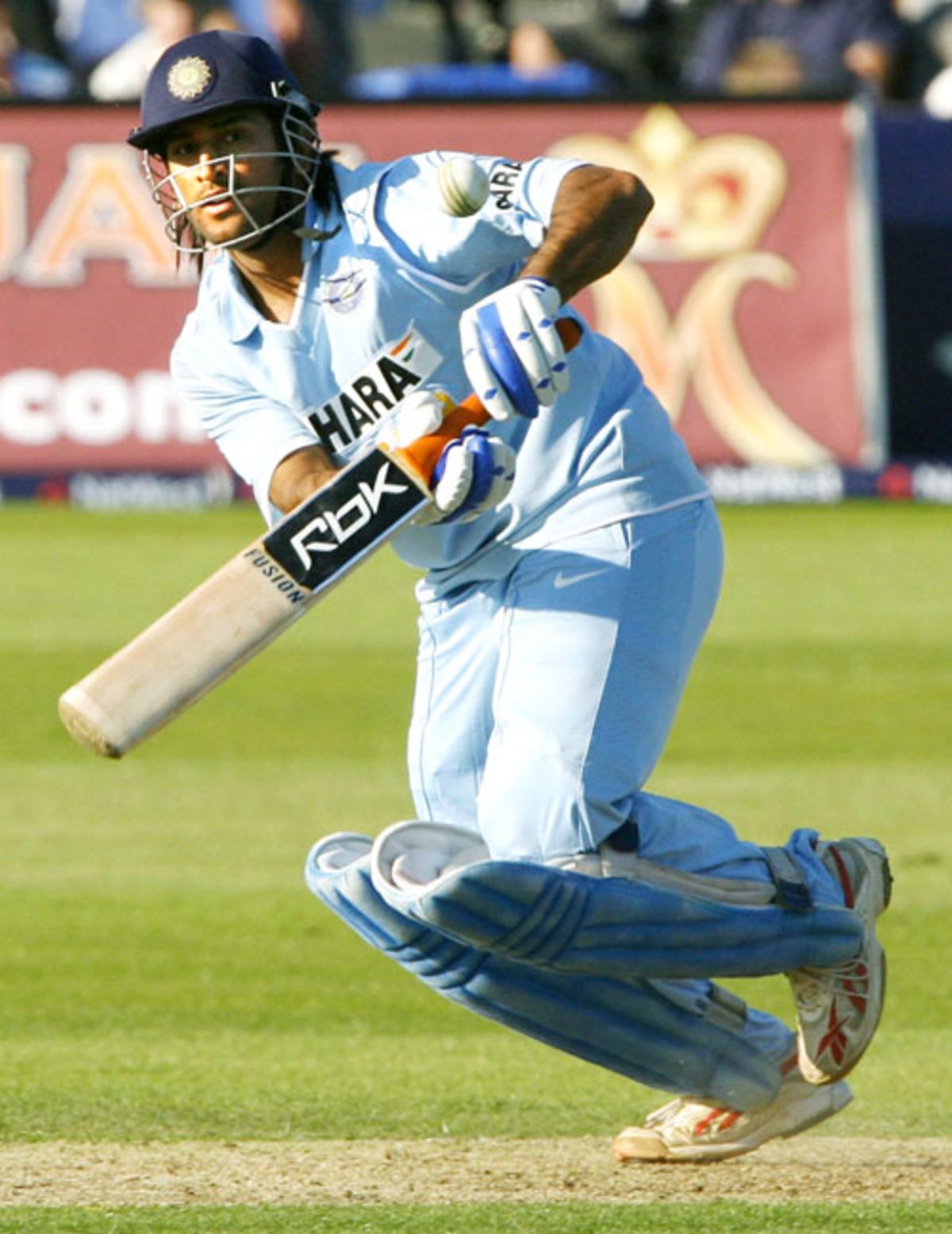 Mahendra Singh Dhoni heads for a run while watching the ball ...