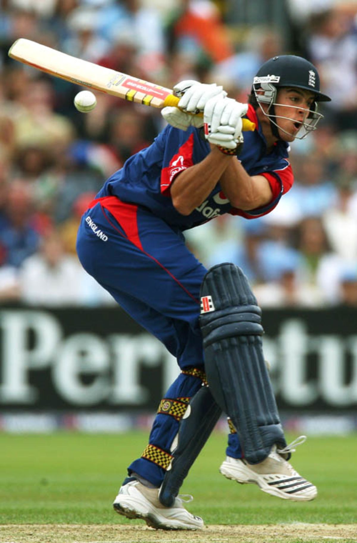 Alastair Cook tries to fend off a rising delivery | ESPNcricinfo.com