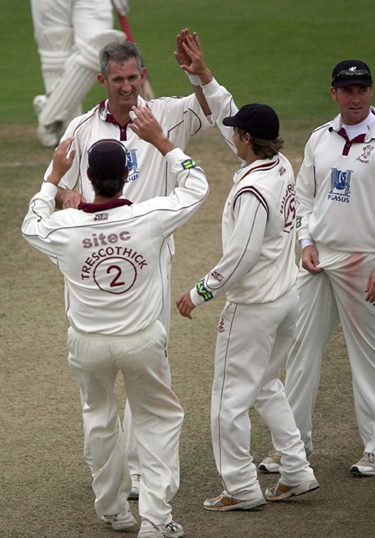 Andrew Caddick sends down another delivery, with a grimace ...