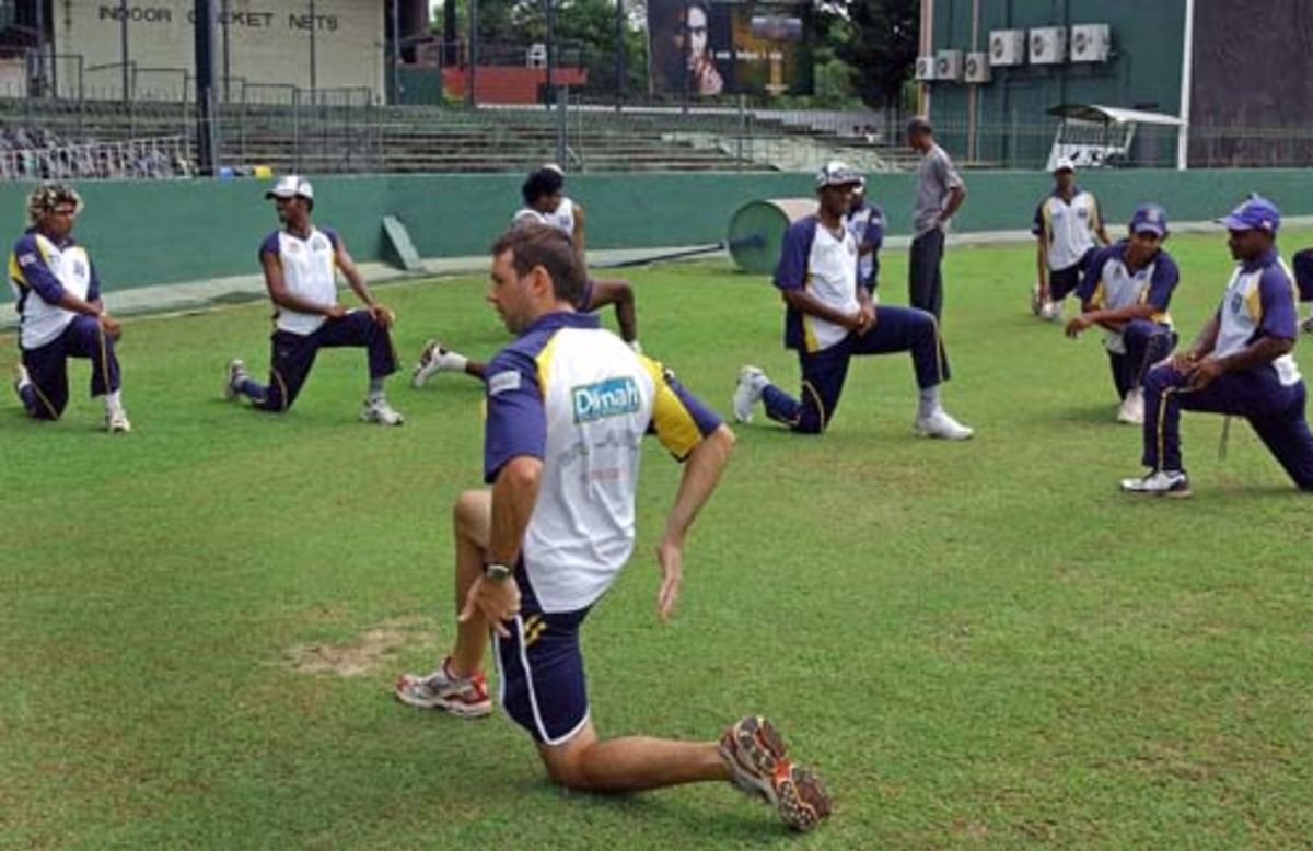 Jade Roberts, the new trainer of the Sri Lanka team, leads a warm-up ...