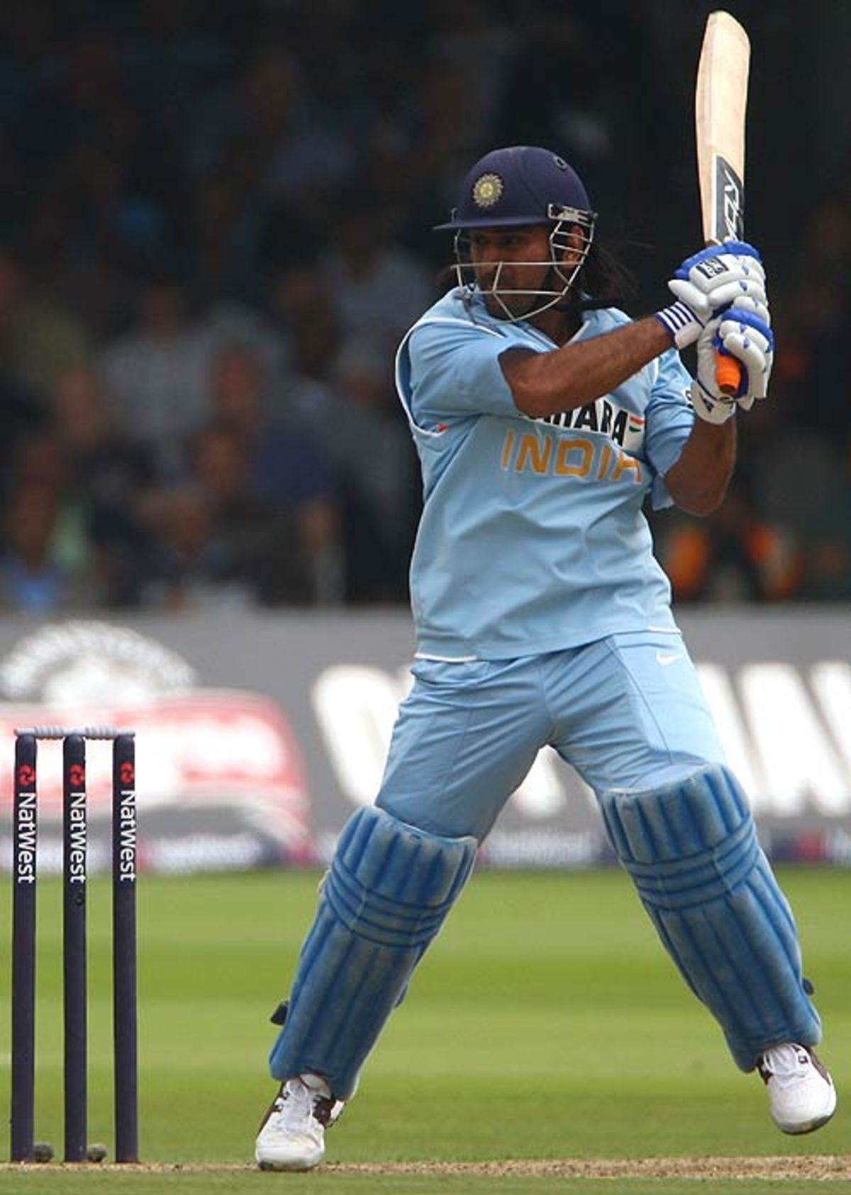 Mahendra Singh Dhoni plays a fierce square cut en route to his half ...