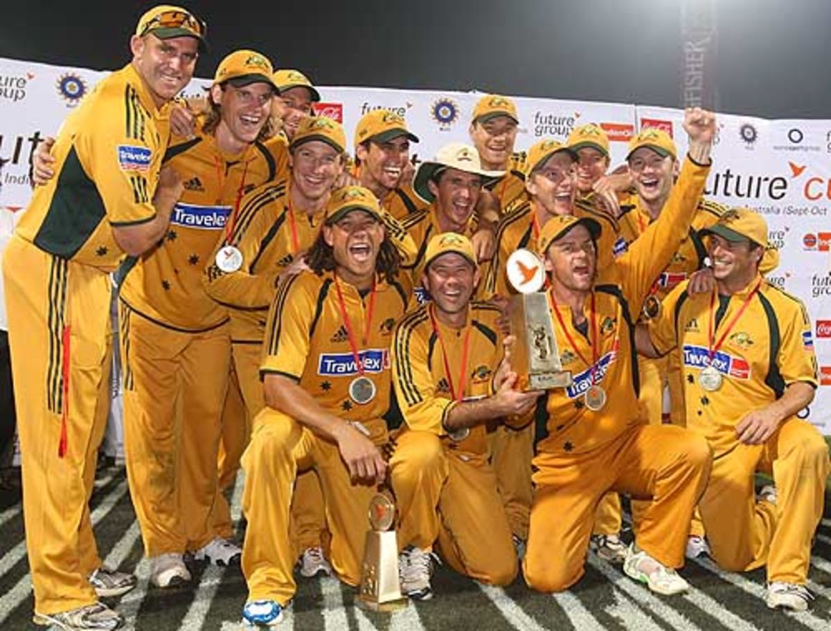 The Australian team is all smiles posing with the Future Cup trophy ...