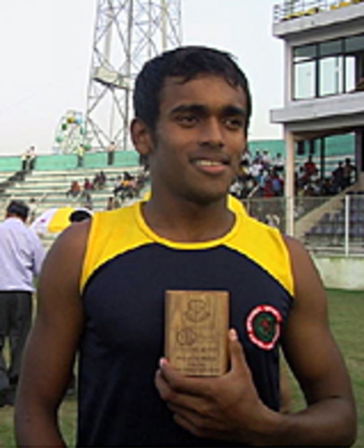 Dhaka's Mehrab Hossain jnr poses with his Man-of-the-Match trophy ...