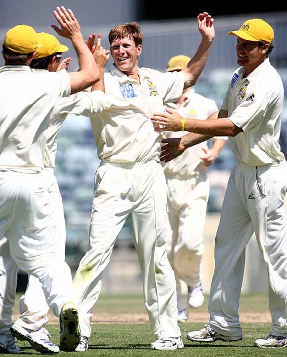 Mathew Inness is congratulated by his team-mates | ESPNcricinfo.com