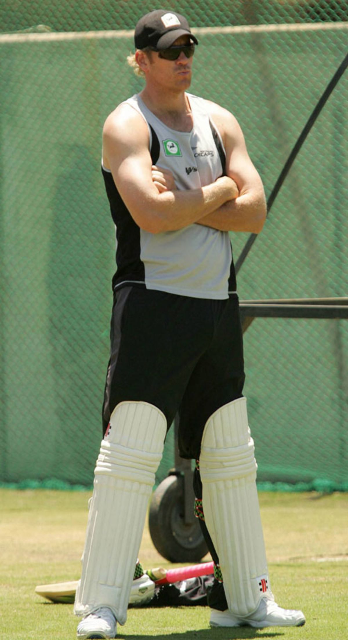 Jacob Oram keeps a close eye on his team-mates in the nets ...