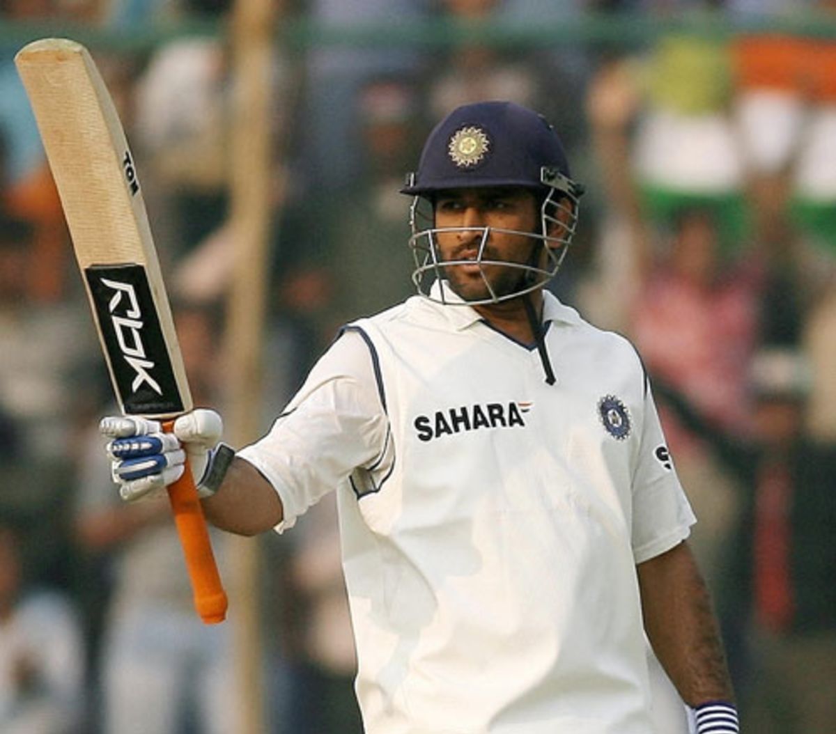 Mahendra Singh Dhoni acknowledges the crowd after his fifty ...