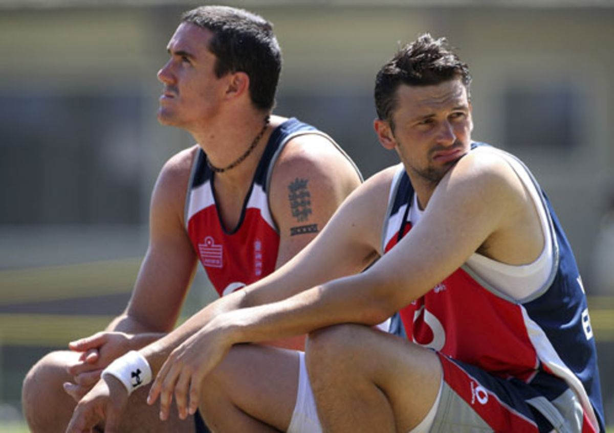 Steve Harmison and James Anderson trudge back to their marks ...