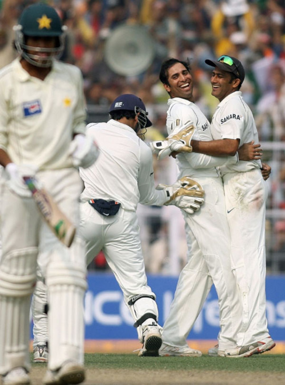 VVS Laxman is congratulated by his team-mates after dismissing Mohammad ...