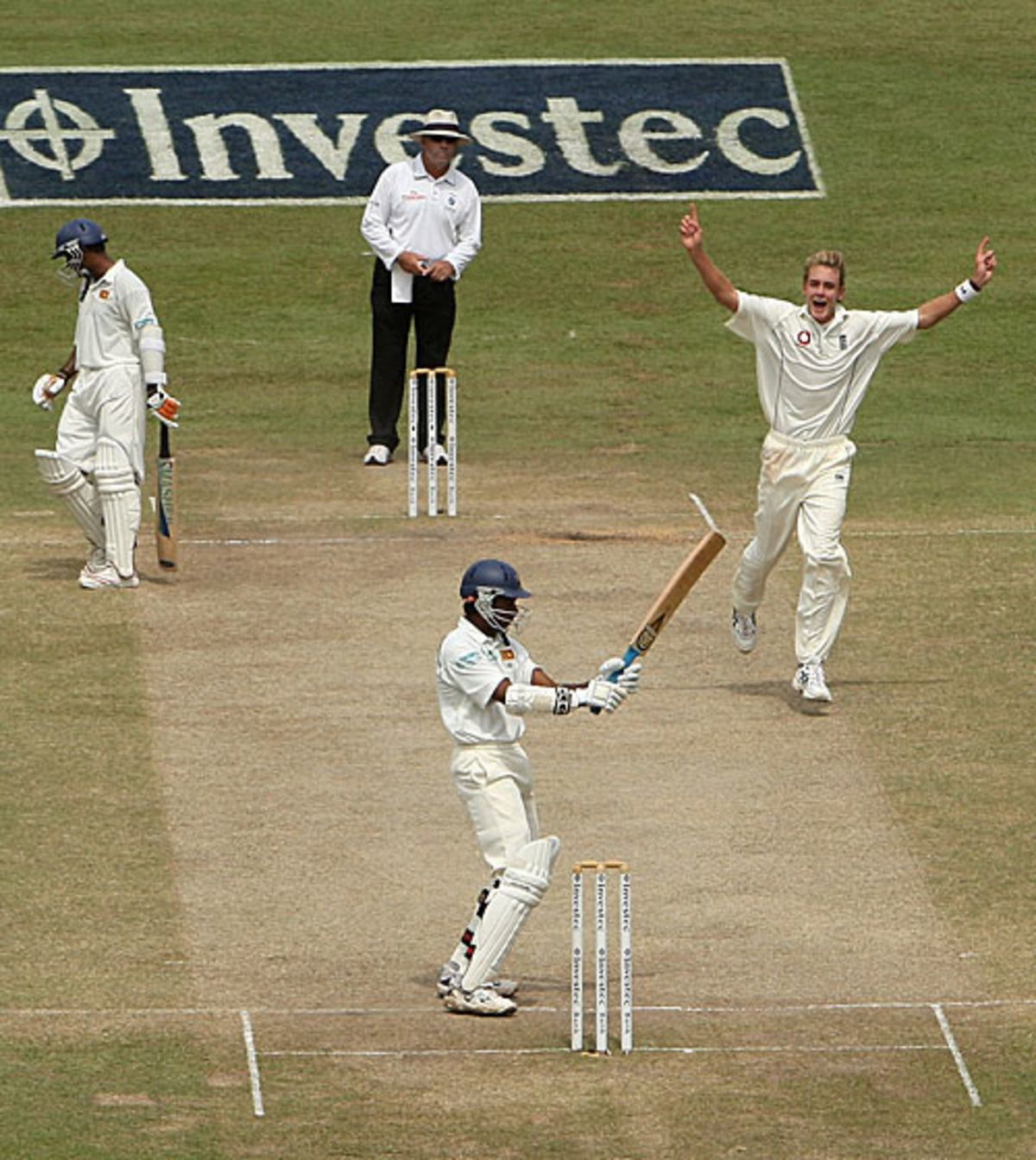 A wide angle shot of Stuart Broad celebrating the wicket of Chaminda ...
