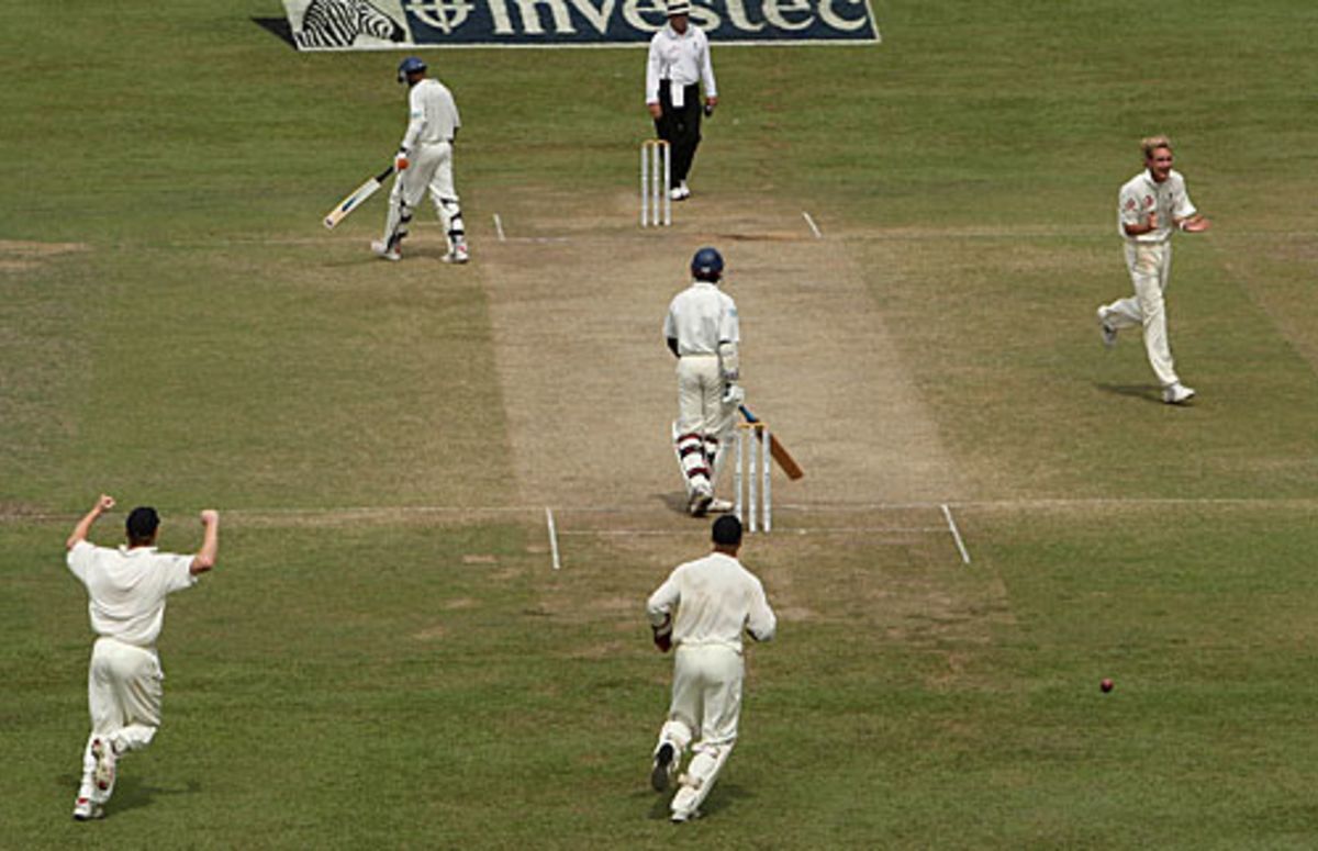 A wide angle shot of Stuart Broad celebrating the wicket of Chaminda ...