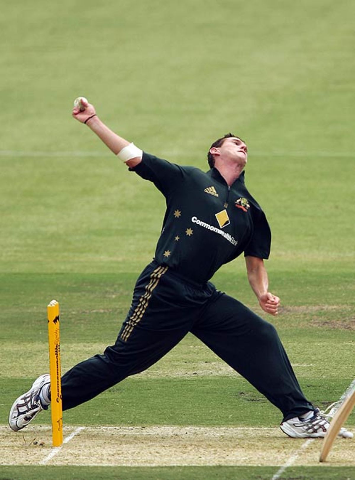 Brett Lee celebrates a wicket with Michael Clarke and Michael Hussey in ...