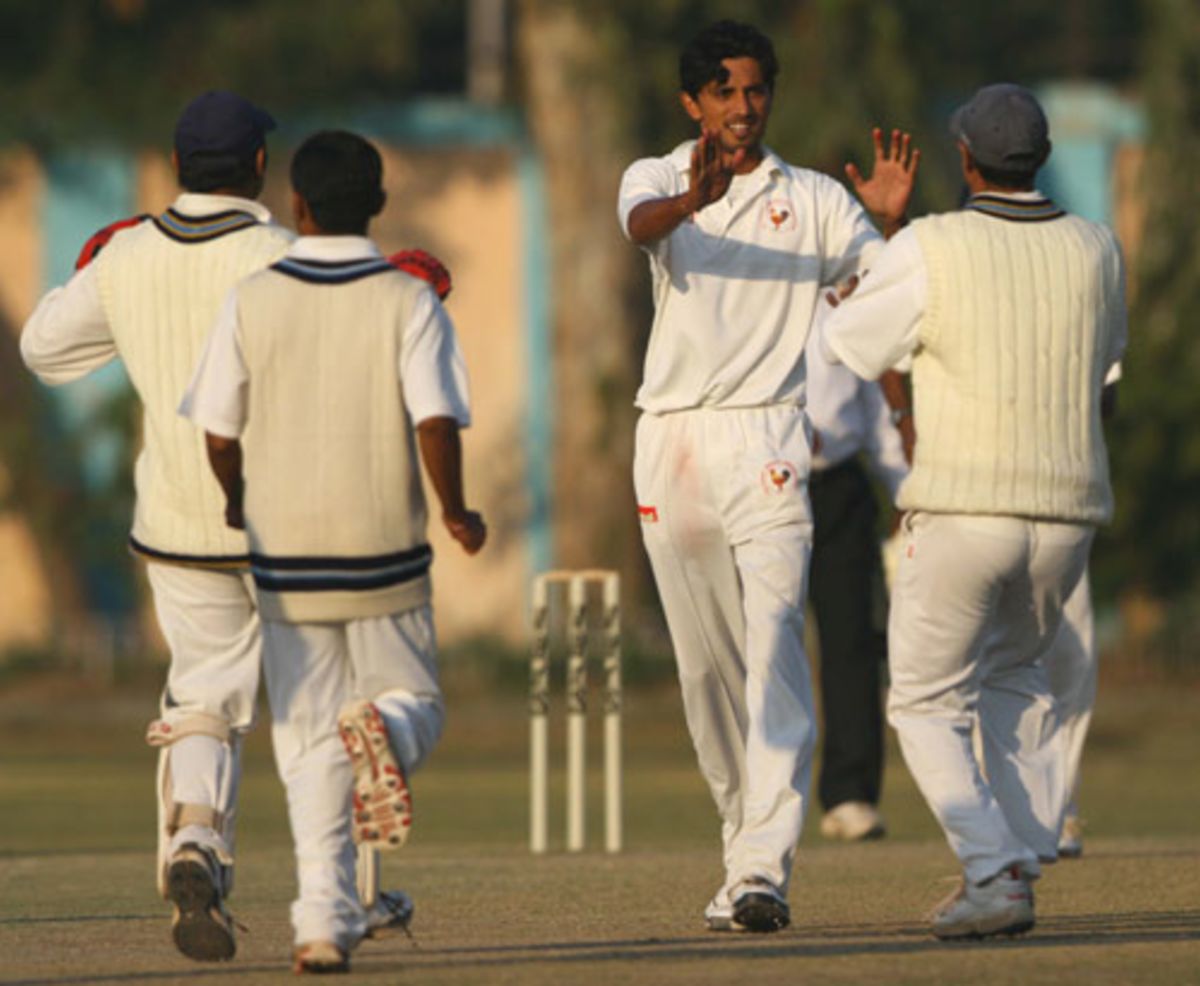Gujarat's Timil Patel powers the ball through the leg side ...