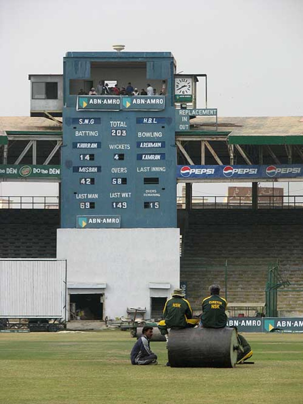 Ground staff at the National Stadium during the rain interval ...