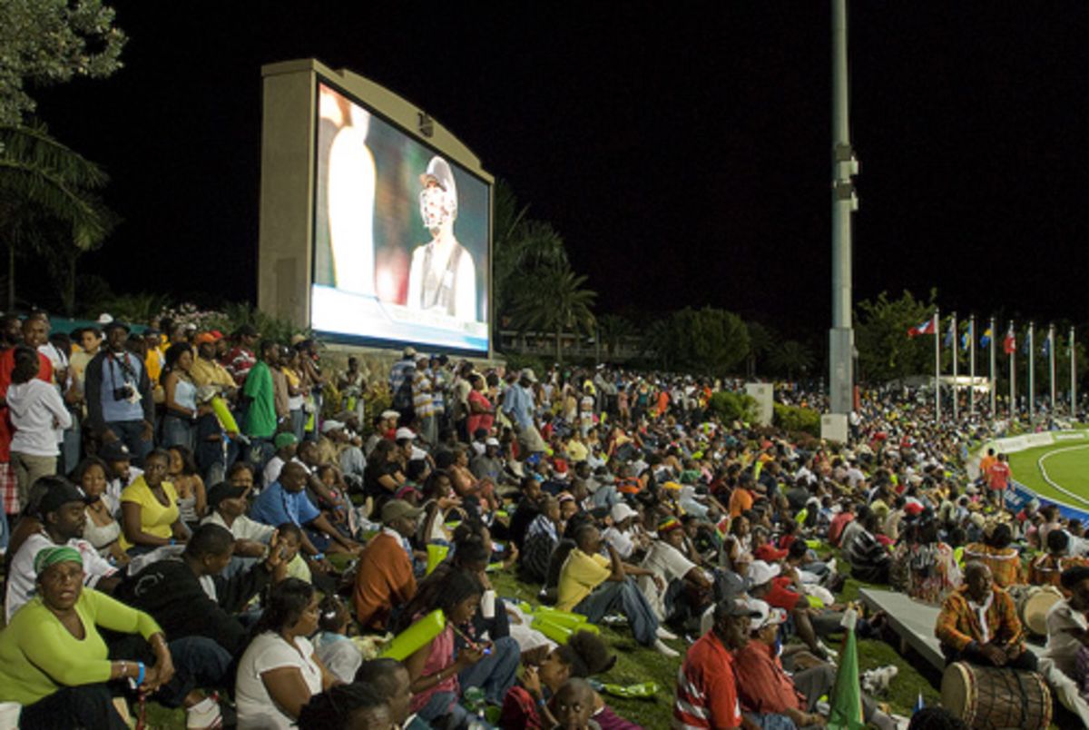 A giant screen relays the on-field action at the Stanford Cricket ...