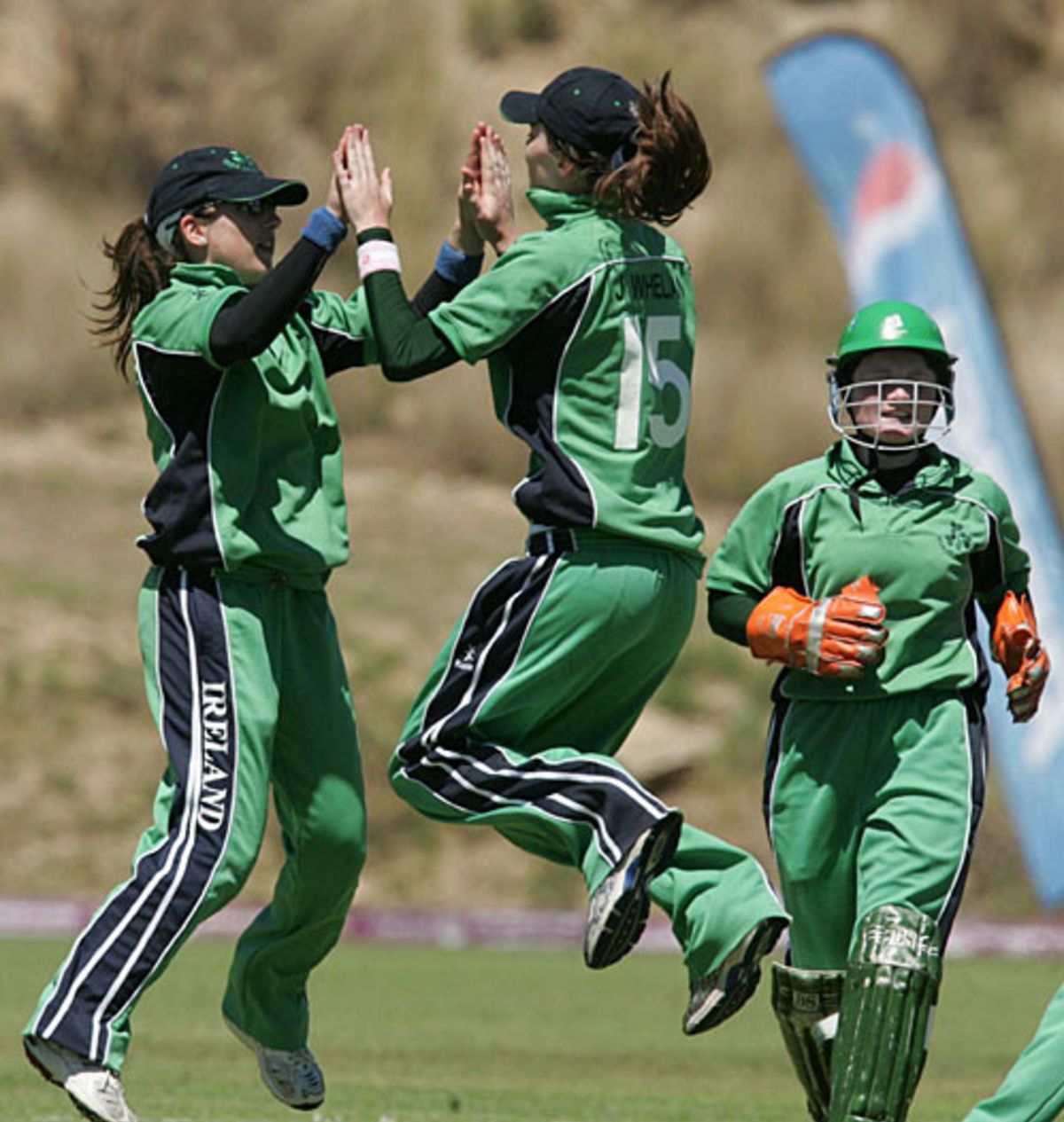Jill Whelan and Cecelia Joyce celebrate the wicket of Kari Anderson ...