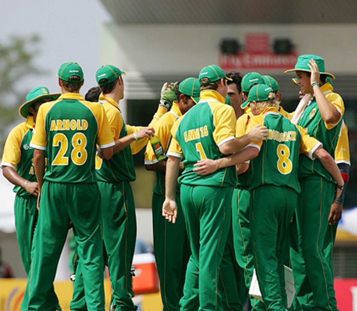 The South African players gather after the fall of a wicket ...
