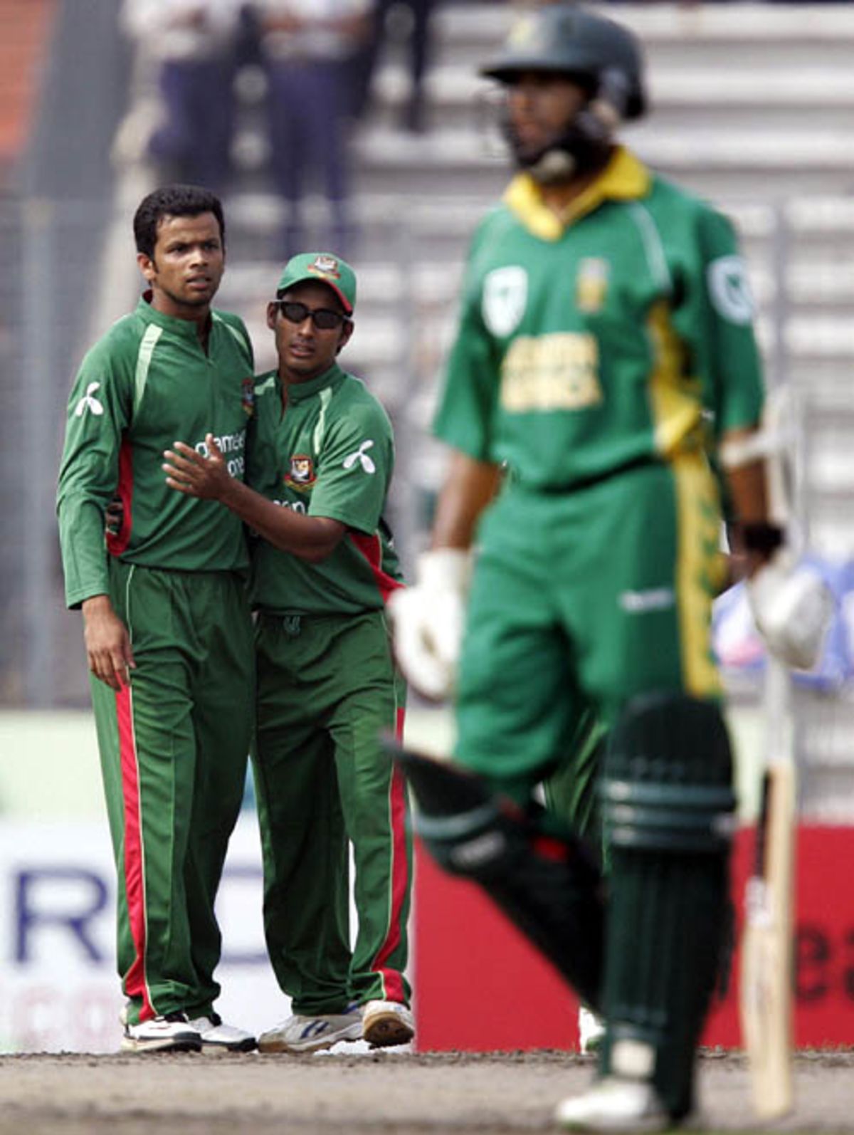 Abdur Razzak and Mohammad Ashraful celebrate the fall of Hashim Amla ...