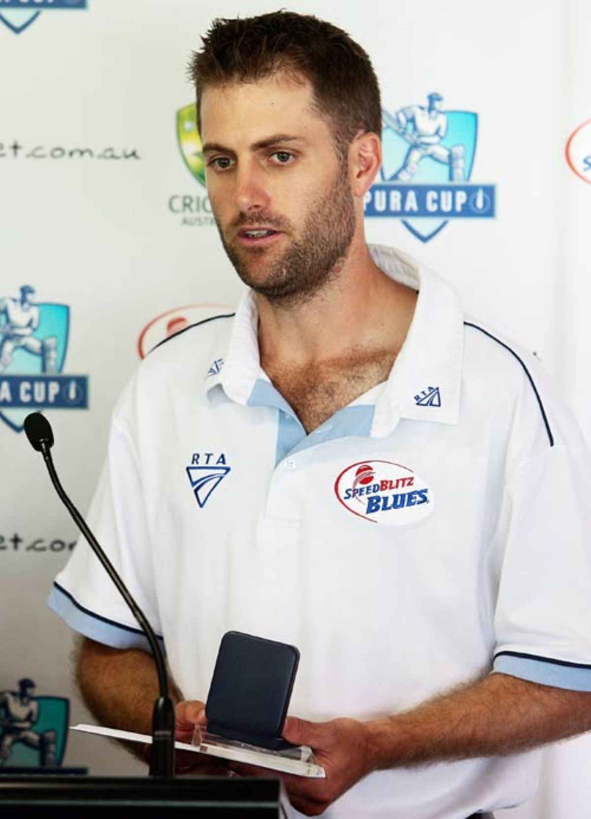 The competing captains Cameron White and Simon Katich with the Pura Cup ...