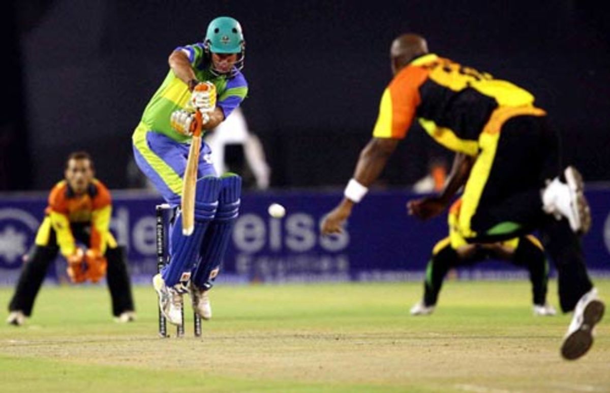 Abdul Razzaq prepares to strike the ball on his way to an unbeaten 78 ...
