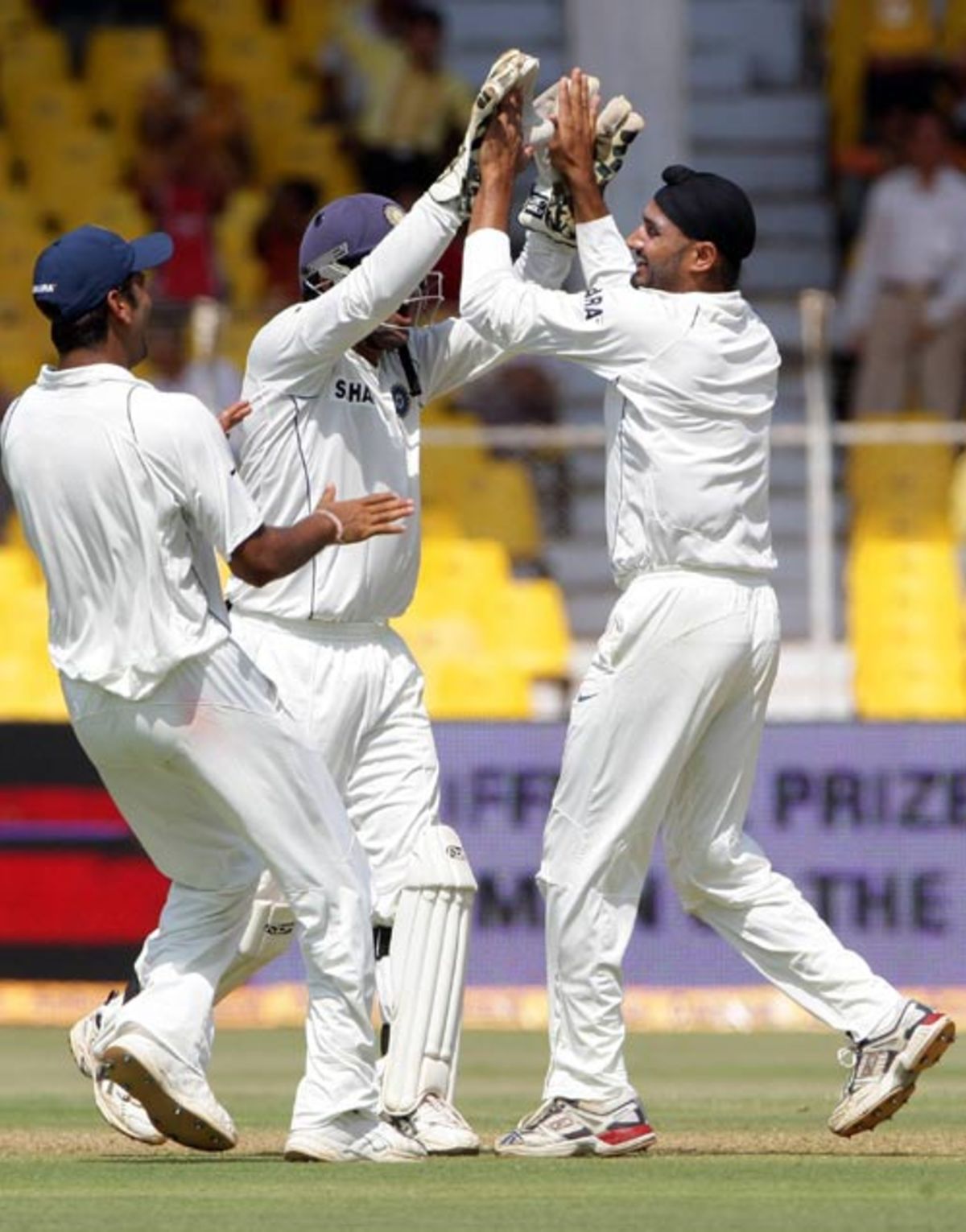 Harbhajan Singh celebrates one of his three wickets on the first day ...
