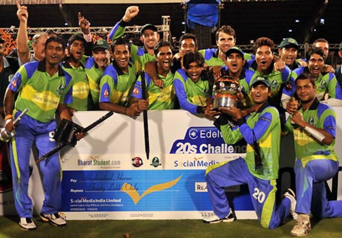 The Hyderabad Heroes pose with the trophy and winner's cheque ...