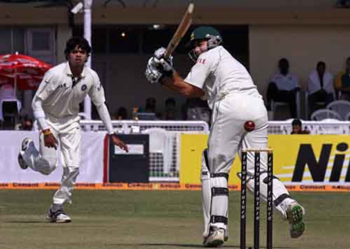 Neil McKenzie plays the ball down the leg side during his 36 ...