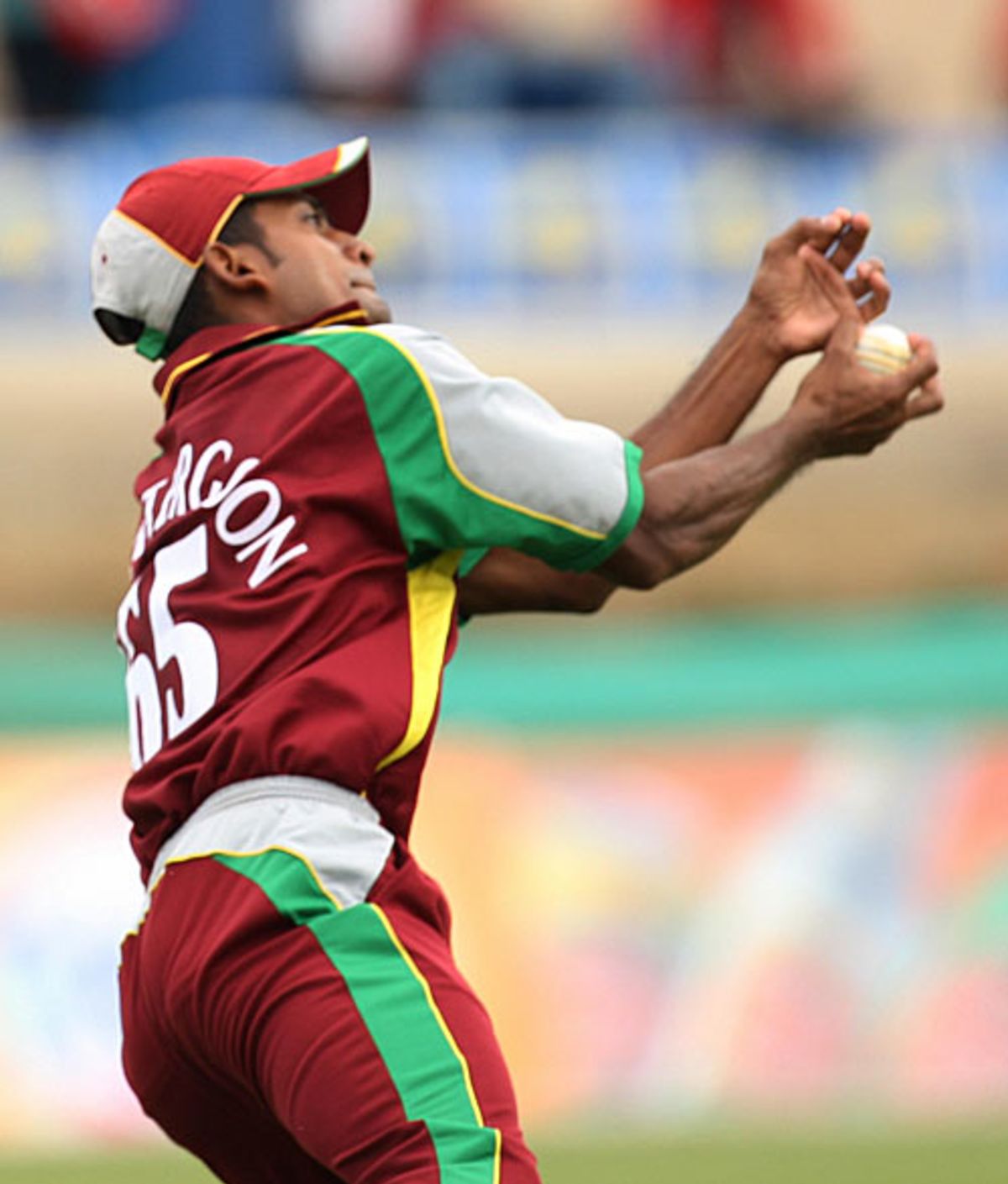 Daren Powell congratulates Sewnarine Chattergoon on his sharp catch at ...