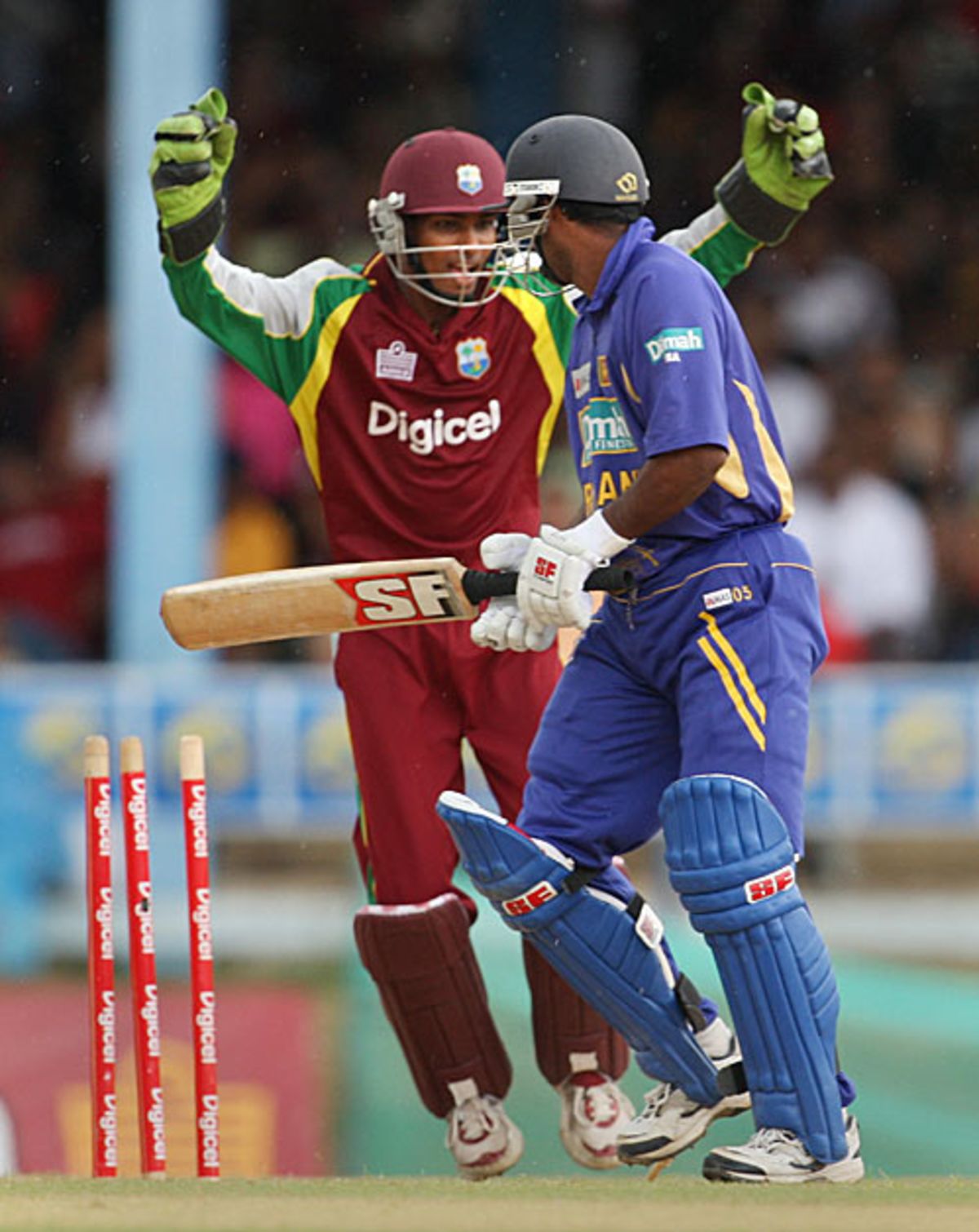 Denesh Ramdin congratulates Chris Gayle on another wicket ...