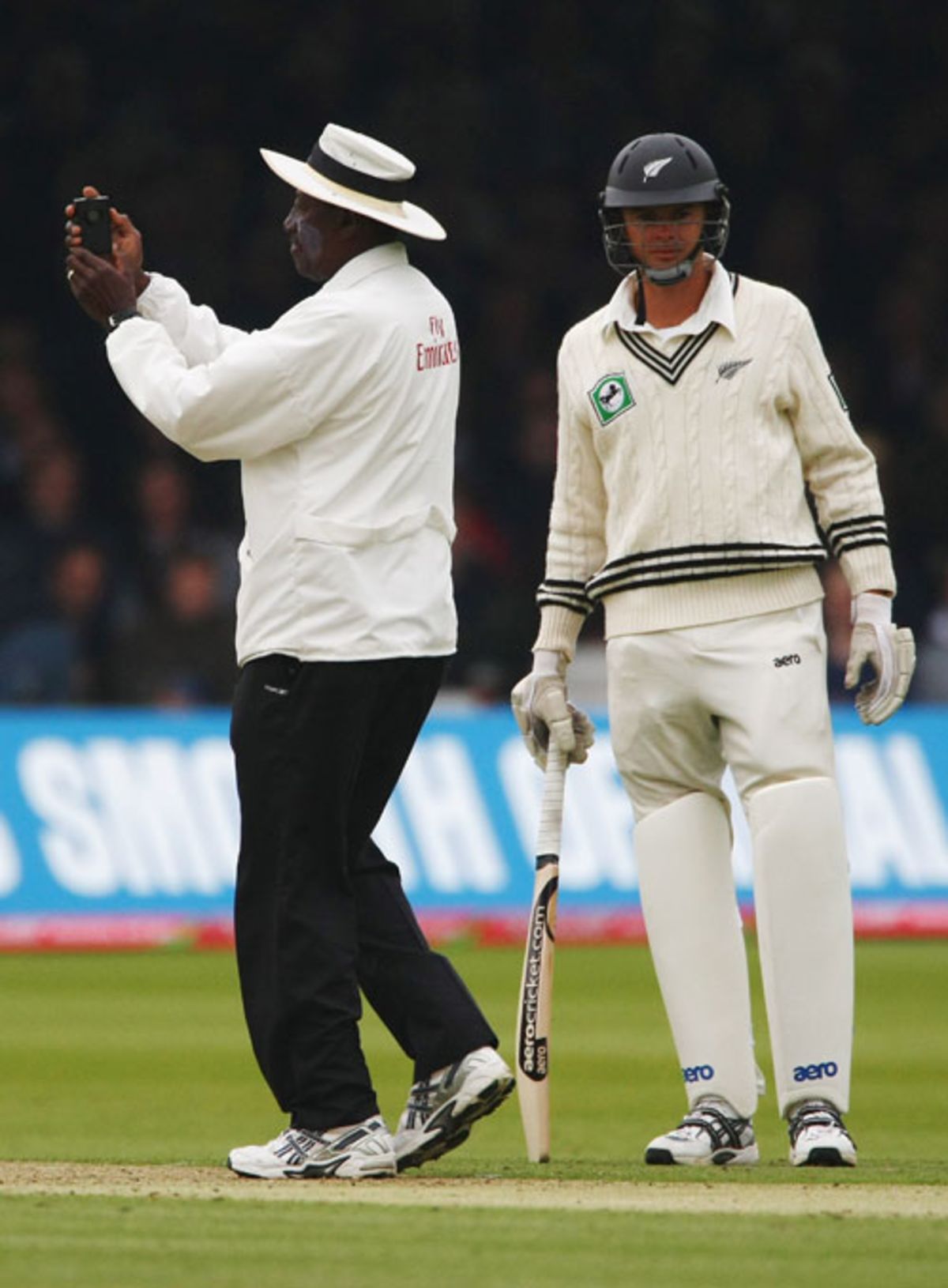 Steve Bucknor checks the light | ESPNcricinfo.com