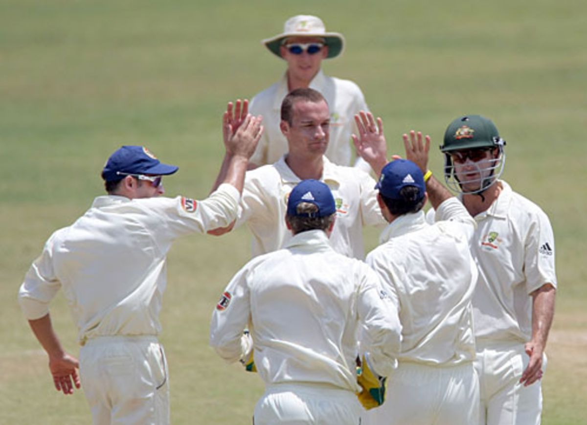 Stuart Clark is congratulated for dismissing opener Simon Jackson ...