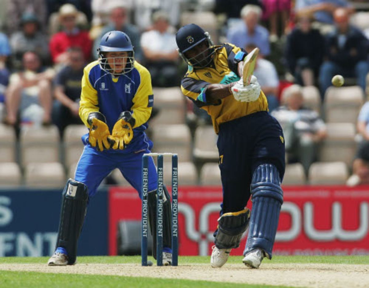 Dimitri Mascarenhas powers the ball down the ground on his way to 26 ...