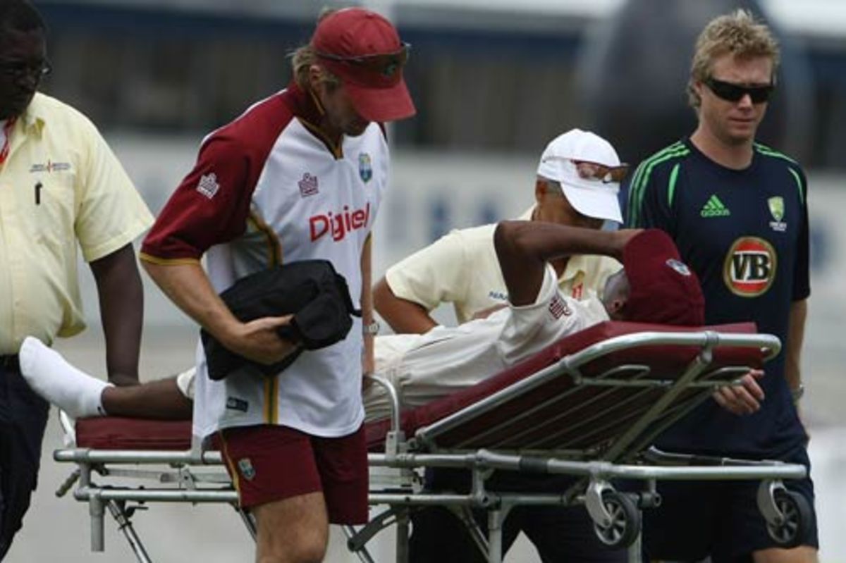 Sewnarine Chattergoon is stretchered off after injuring his ankle ...