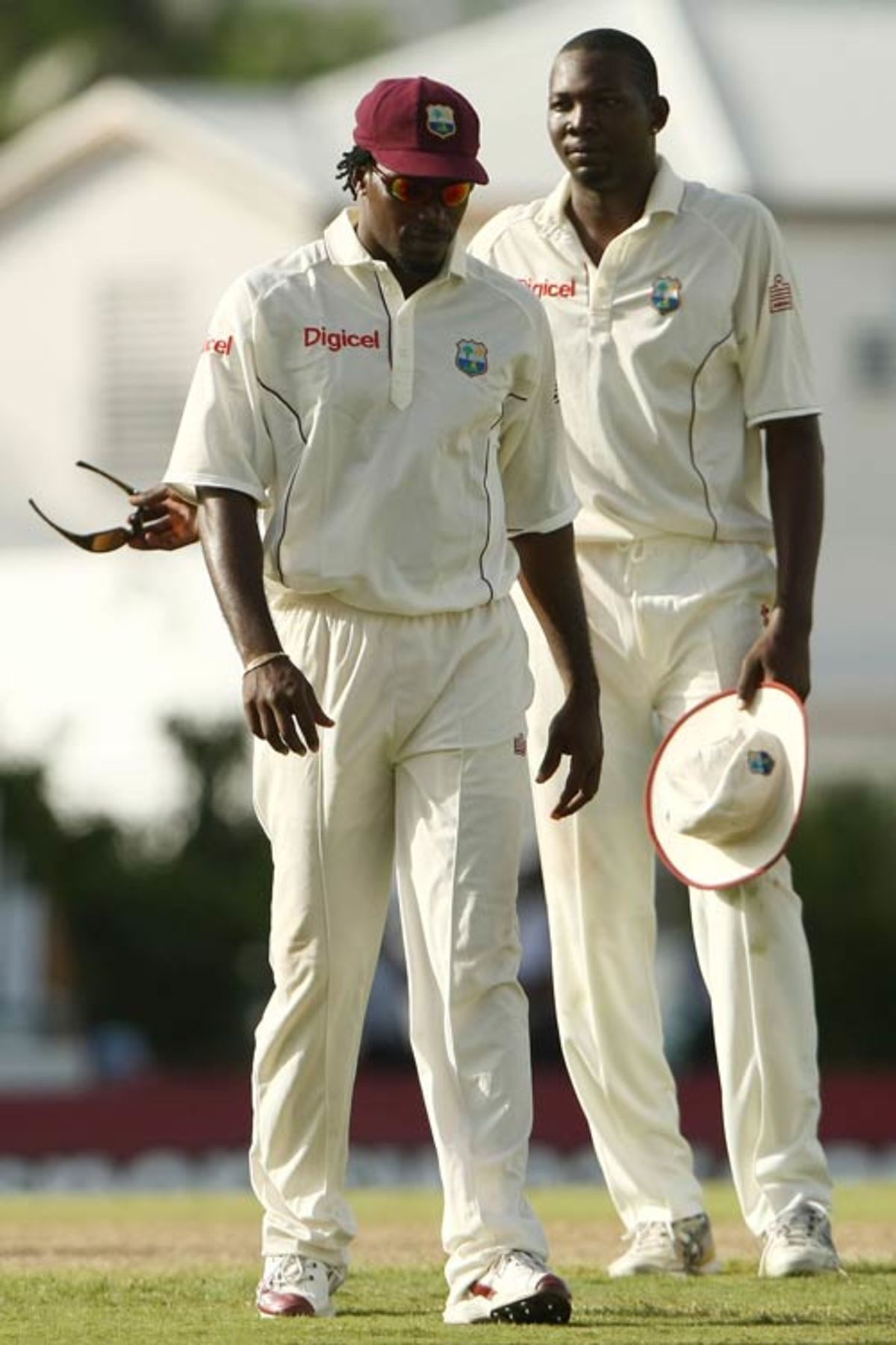 Sulieman Benn and Chris Gayle on a tough day for the spinners ...