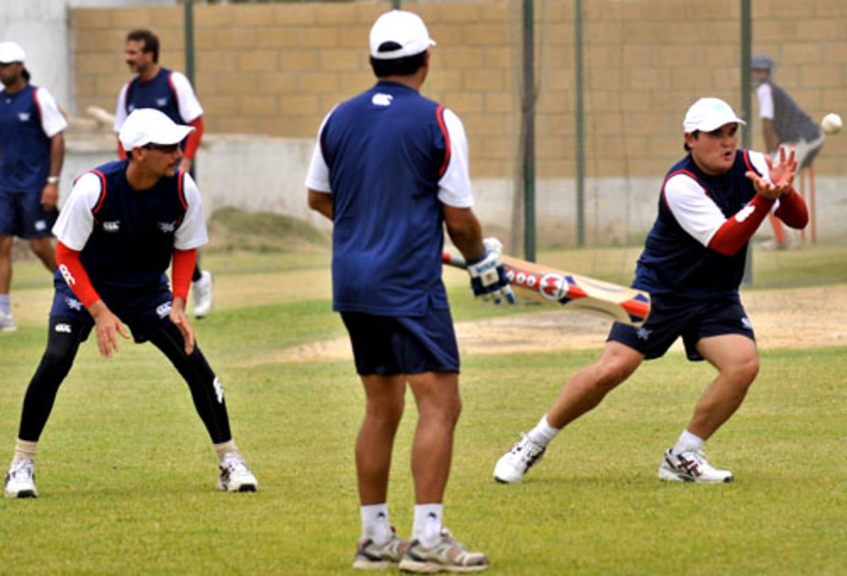 Roy Lamsam prepares to take a catch during Hong Kong's training session ...