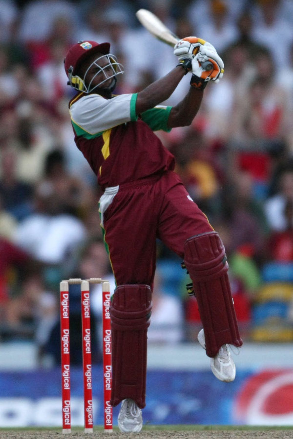 Dwayne Bravo pulls the ball into the stands to bring up West Indies ...