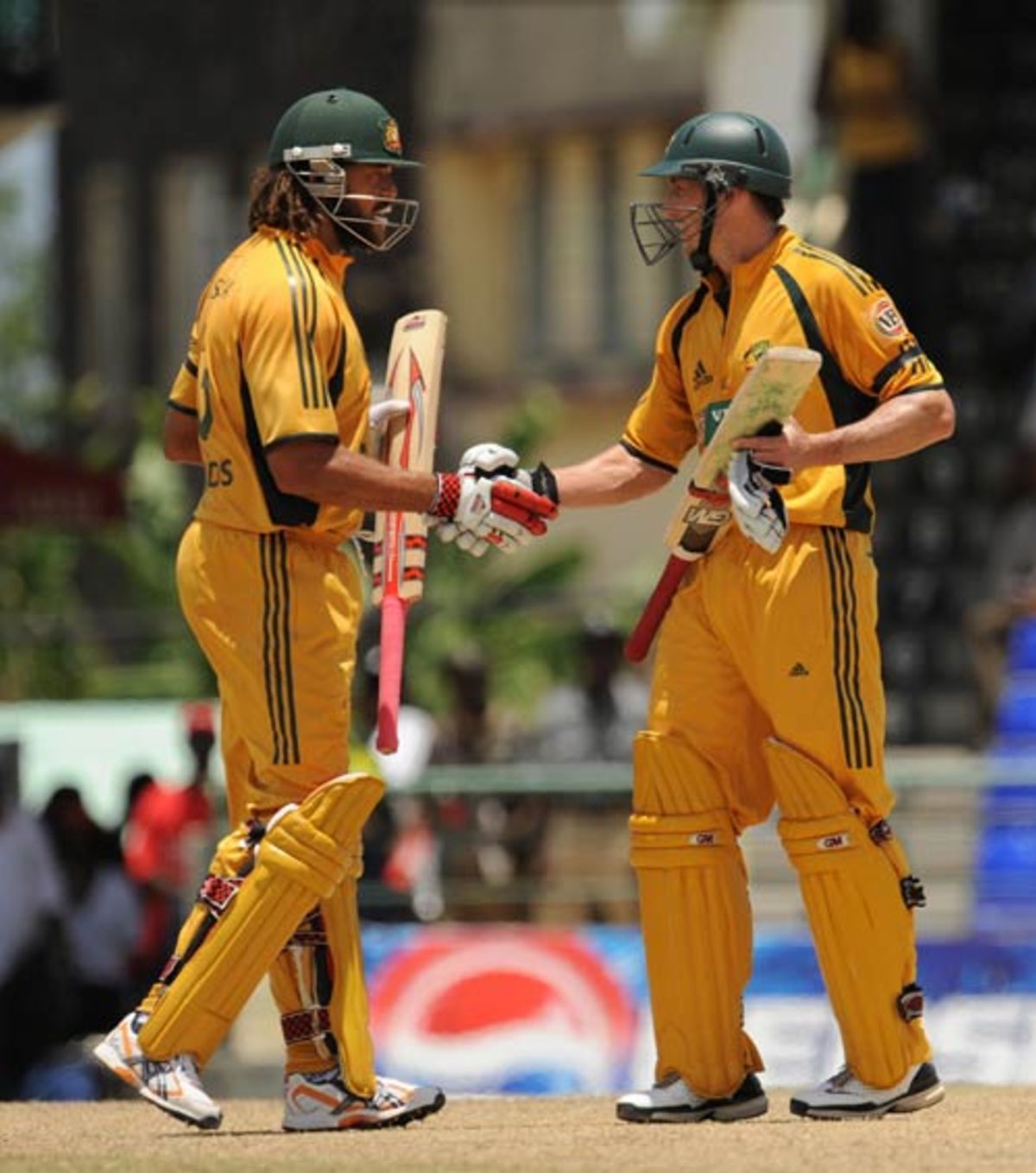 David Hussey congratulates Andrew Symonds on his half-century ...
