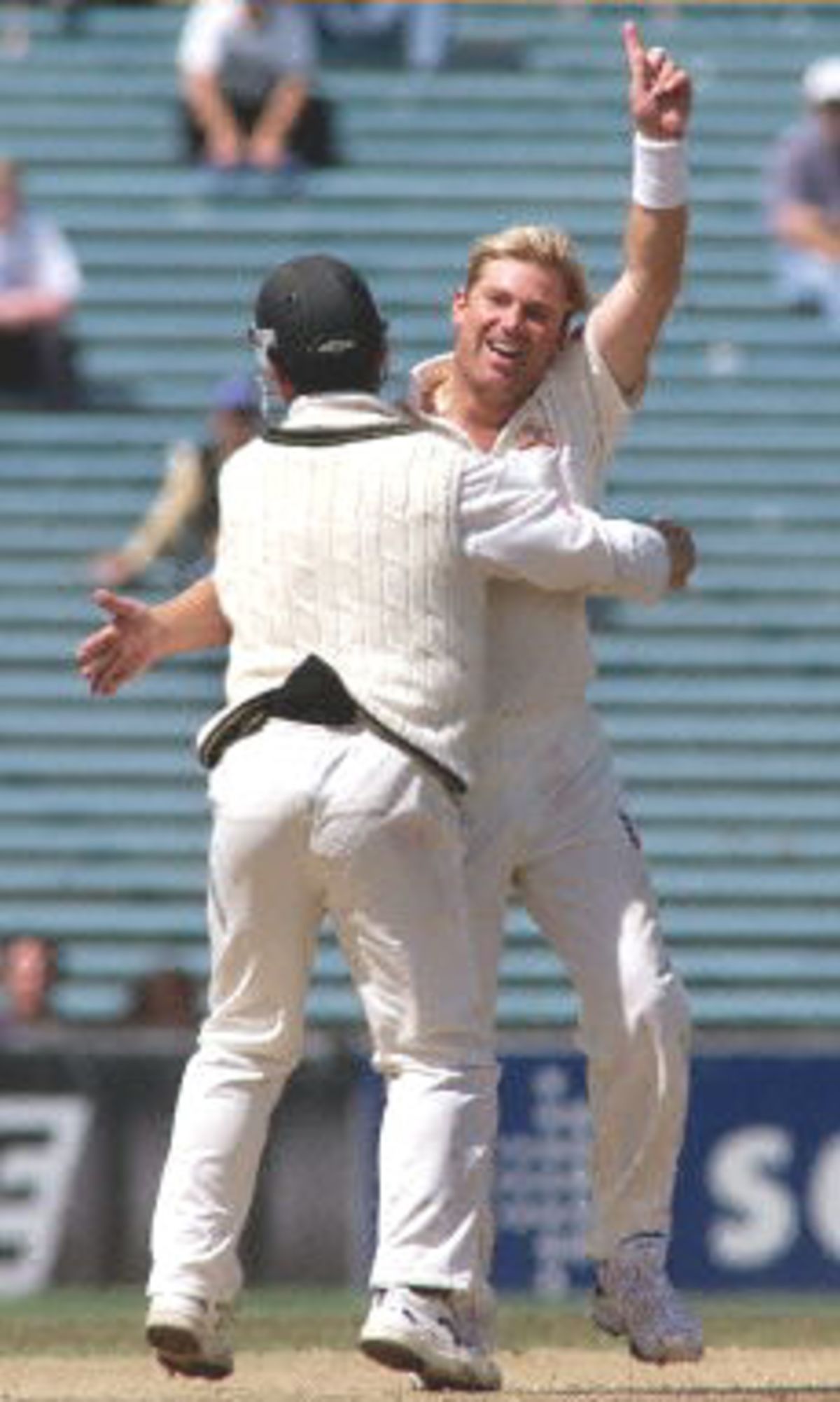Warne celebrates after picking the wicket of Paul Wiseman ...