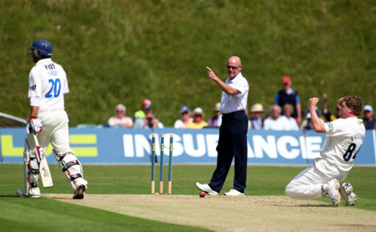 Jeff Evans raises his finger as David Balcombe celebrates running out ...